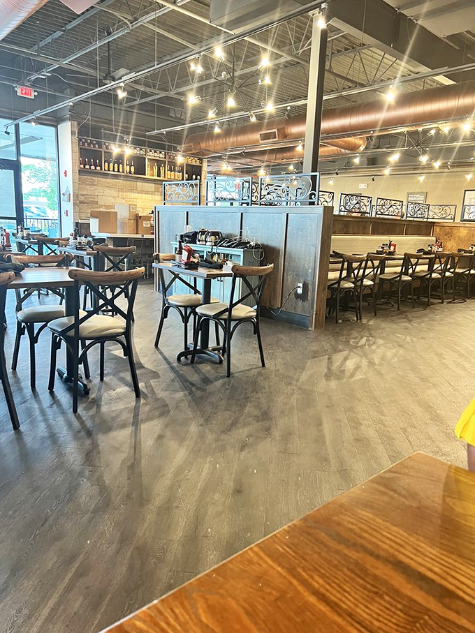 Industrial-chic meets cozy comfort inside, where natural light floods the thoughtfully designed space that somehow feels both upscale and homey.