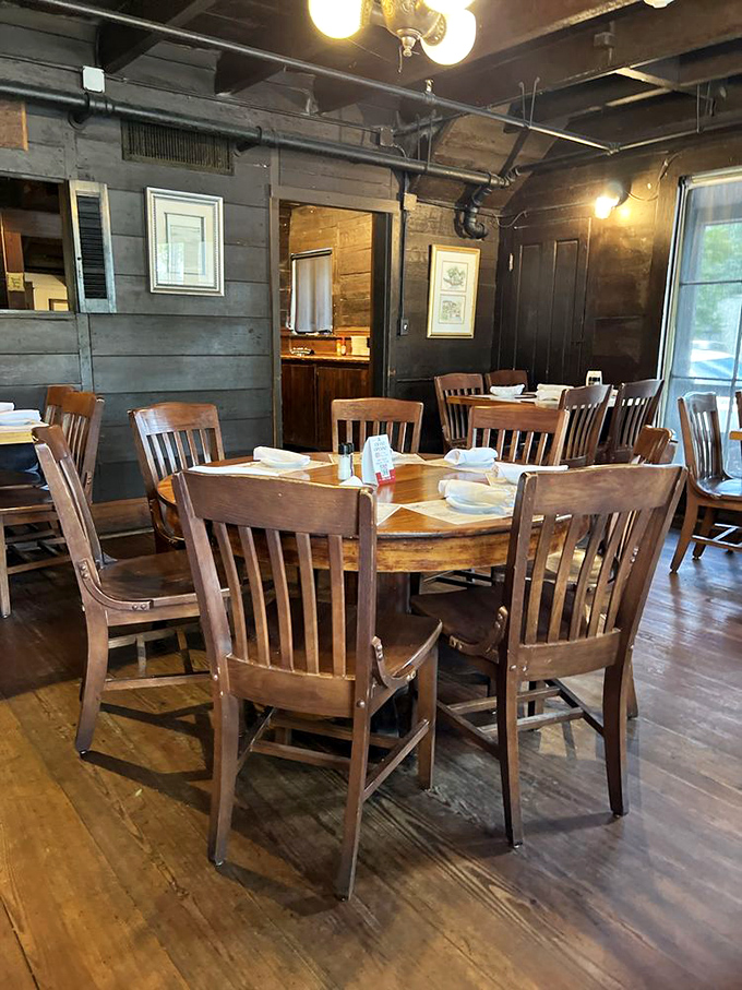 Dark wooden walls and sturdy furniture create an atmosphere where you can almost hear the whispers of sailors who dined here centuries ago.