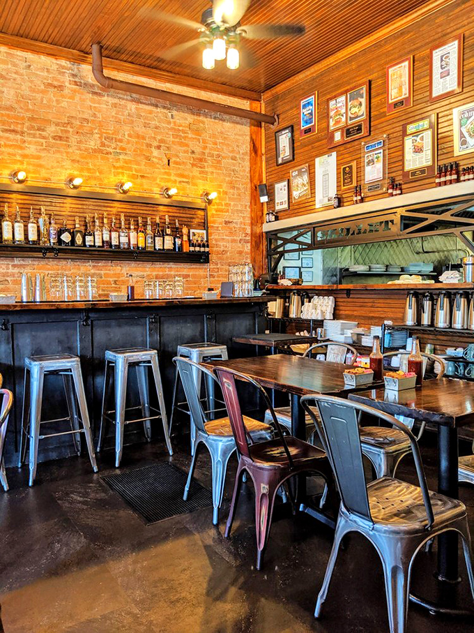 Exposed brick, wooden ceilings, and industrial-chic seating create that perfect "rustic urban" vibe that makes you feel instantly at home.