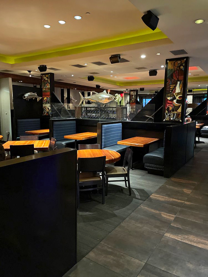 The modern interior blends nautical touches with contemporary design. Those blue booths aren't just stylish&mdash;they're front-row seats to seafood nirvana.
