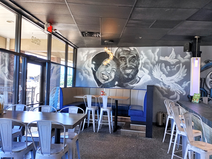 Modern meets soulful in CJ's interior, where striking murals and comfortable seating create an atmosphere that feels both contemporary and warmly familiar.