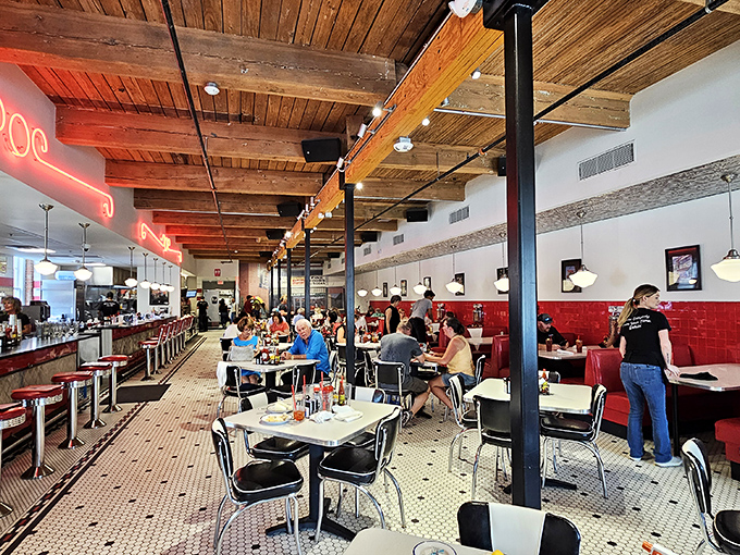 Where wooden beams meet red vinyl booths, conversations have flowed for generations. This isn't retro design&mdash;it's the real deal.