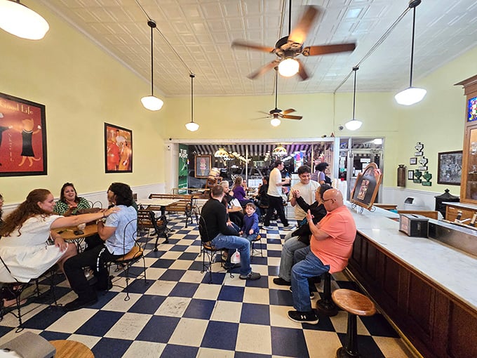 Step back in time on that classic black and white checkered floor, where ceiling fans lazily spin above ice cream dreams.