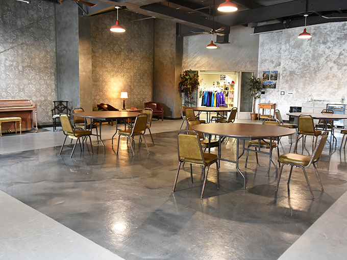 The modern meeting space blends medieval charm with practical comfort. No jousting required to claim a seat at these round tables.