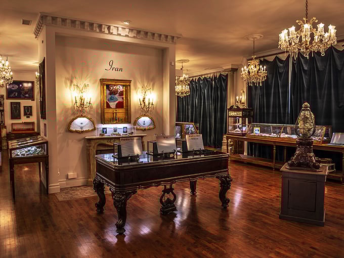 Elegance meets education in this opulent display room where crystal chandeliers illuminate antique display cases housing turquoise treasures from around the world.