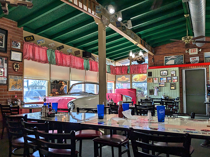Where nostalgia meets appetite. The vintage car display inside Crazy Otto's isn't just decor&mdash;it's a reminder that some American classics never go out of style.