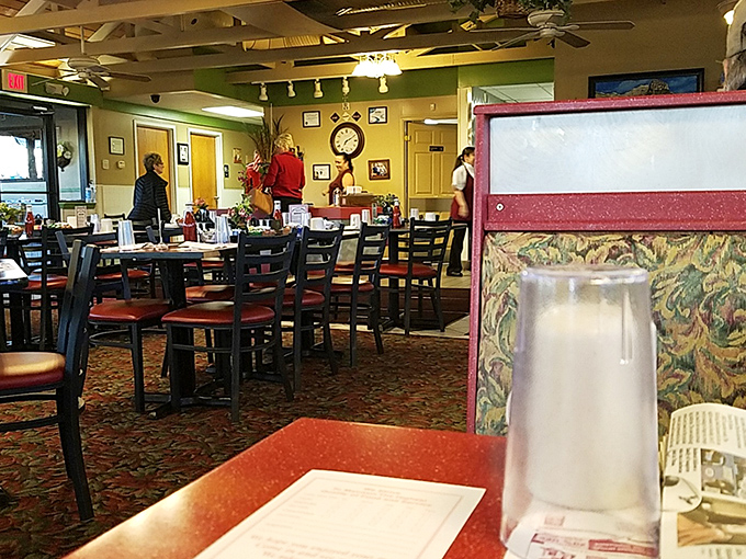 Classic diner ambiance with all the comfort of grandma's kitchen. The patterned carpet has witnessed more breakfast epiphanies than most philosophers.