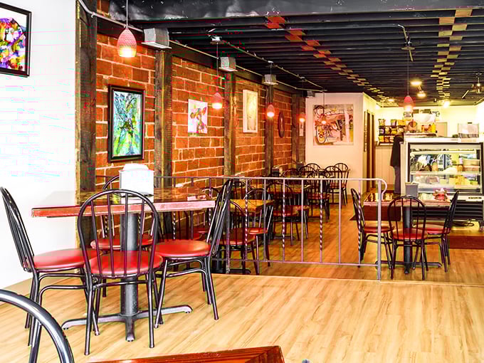 Exposed brick walls and red-topped tables create the perfect backdrop for sandwich artistry. This isn't décor—it's a time machine to when meals were made with care.