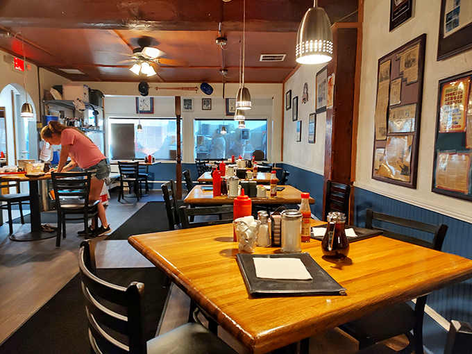 Inside, wooden tables and blue wainscoting create that perfect diner vibe where memories are made. The kind of place where every table tells a story of satisfied appetites.