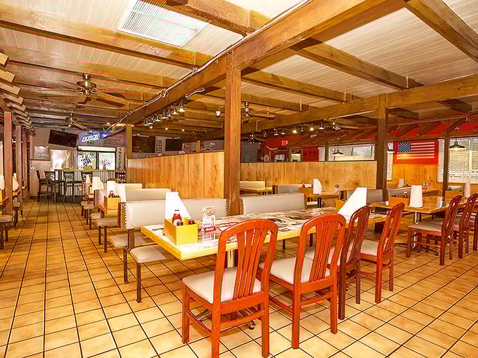 Where exposed wooden beams meet comfort food dreams. The orange chairs aren't asking for your fashion approval&mdash;they're demanding you sit down and order seconds.