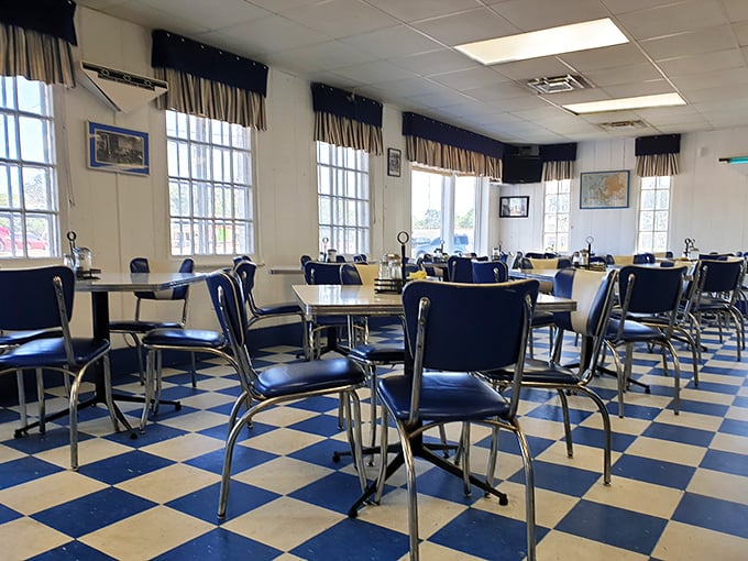 Step into a time capsule of Americana with the classic blue and white checkerboard floor. These vintage booths have witnessed decades of local gossip and satisfied appetites.