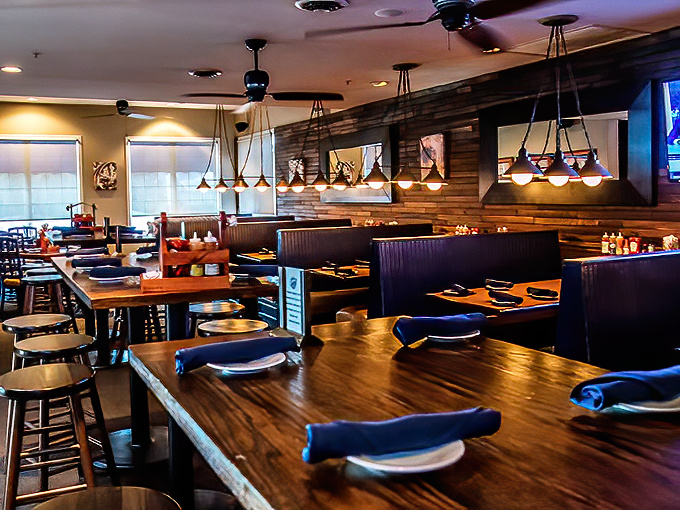 Polished wood tables and blue napkins create the perfect stage for barbecue drama to unfold. Like a well-directed food film, the setting matters.