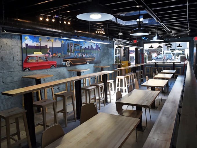 Modern industrial meets Mediterranean warmth inside KouZina. Those wooden tables have heard countless "mmms" and "you've got to try this!"