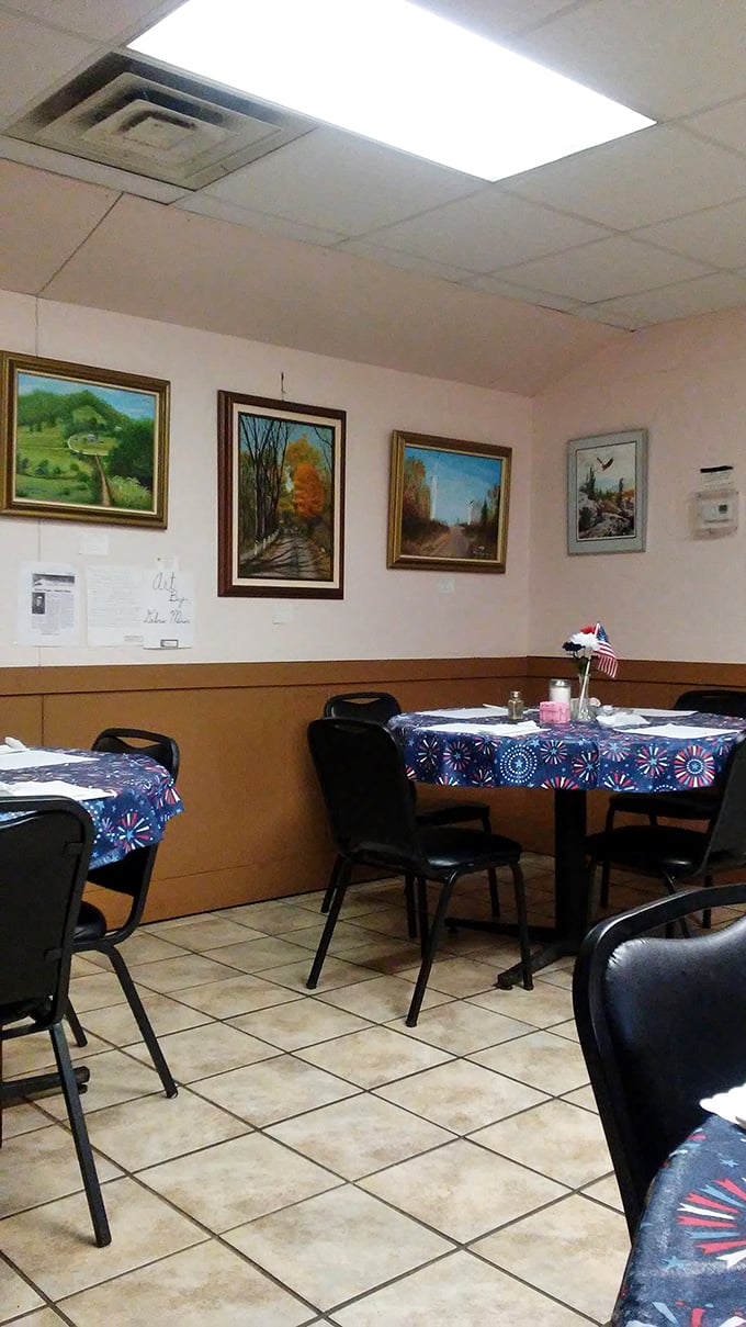 Simple tables, landscape paintings, and patriotic tablecloths &ndash; the dining room at Mom's Place feels like the West Virginia version of your grandmother's Sunday best.