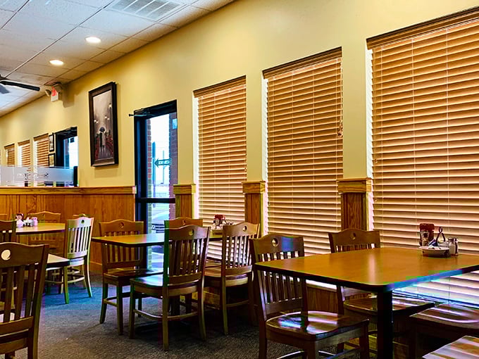 Wooden blinds filter morning light across comfortable seating, creating that perfect "I could linger here all day" ambiance that every great breakfast spot needs.