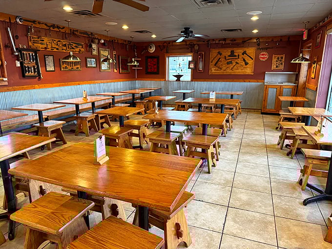 Rustic wooden tables and corrugated metal wainscoting create the perfect no-nonsense backdrop for the serious business of barbecue appreciation.