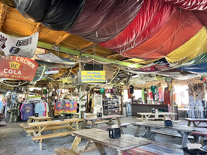 Colorful fabric canopies transform the ceiling into a psychedelic dream. It's like dining inside a kaleidoscope that smells of smoked meat.