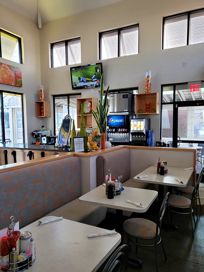 High ceilings, natural light, and comfortable booth seating create the perfect atmosphere for lingering over that essential second cup of coffee.