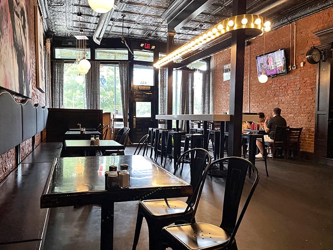Where exposed brick meets warm lighting, creating that perfect "third place" between work and home. The tin ceiling and industrial touches somehow make you feel both transported and right at home.