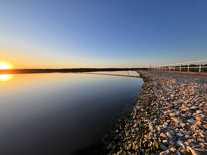 Sunset transforms Long Branch into a mirror of liquid gold. This is the moment locals live for&mdash;when the lake becomes a canvas painted with fire.