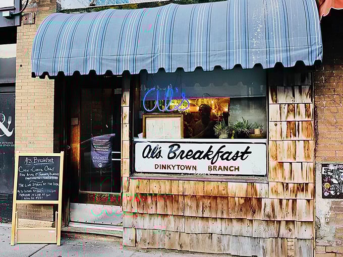 Al's Breakfast storefront: "Dinkytown's wooden wonder might be narrower than my hallway but serves pancakes wider than your smile. Worth the squeeze!"