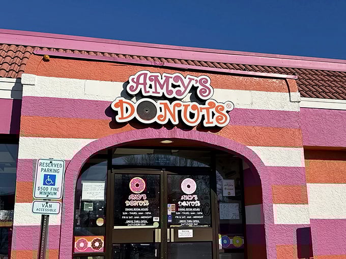 Amy's Donuts brings Willy Wonka vibes to Columbus with its candy-striped exterior. Even the building looks delicious!
