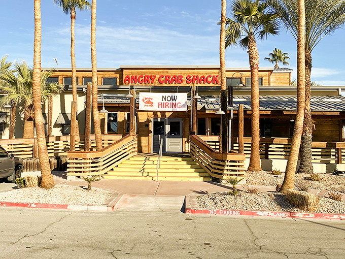 Palm trees frame the entrance to Angry Crab Shack, where seafood comes in bags and finger-licking is strongly encouraged.