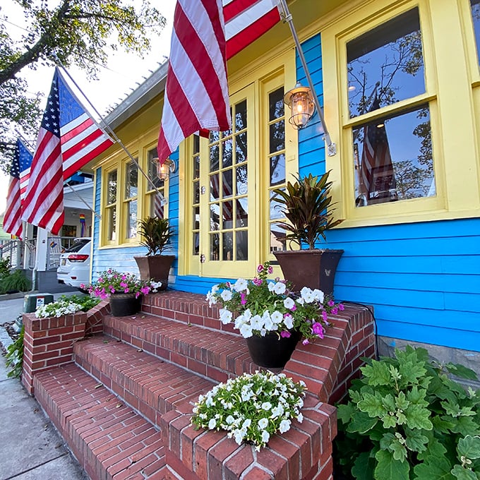 The Blue Moon's vibrant facade pops with personality&mdash;American flags and flower boxes creating a welcoming oasis in Rehoboth Beach.