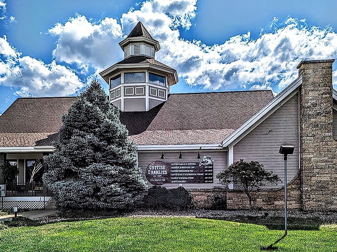 Catfish Charlie's lighthouse-style tower stands like a coastal mirage in landlocked Iowa's river country.