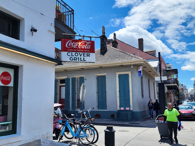The Clover Grill's vintage sign promises "WORLD'S BEST HAMBURGERS" – a bold claim that generations of satisfied diners might just back up.