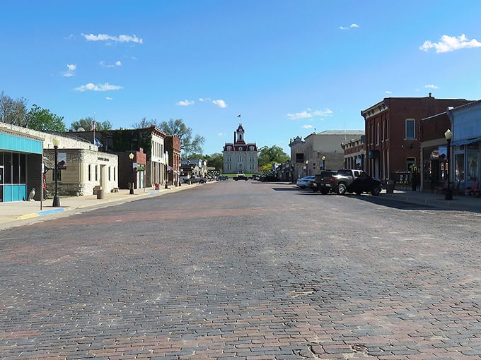 Cottonwood Falls' brick-paved Broadway leads straight to that courthouse like the yellow brick road to a limestone Oz.