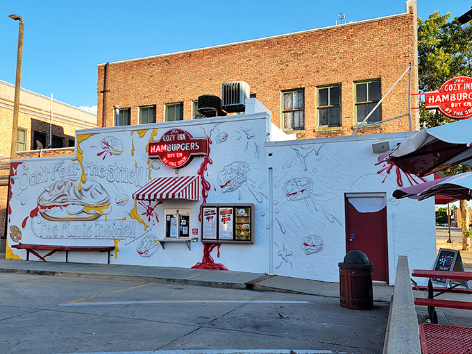 Cozy Inn: "Hamburger heaven in a humble package! This little white building houses Salina's legendary slider spot&mdash;where onions rule and napkins are non-negotiable."