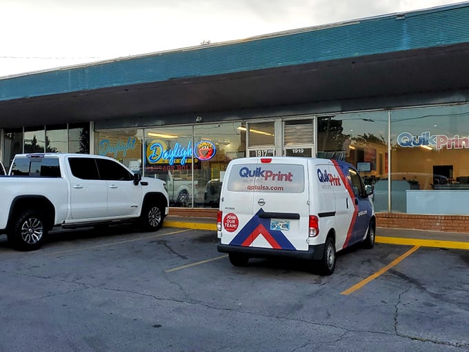 Daylight Donuts' humble storefront hides a wonderland of fried perfection. Like finding a secret treasure map to breakfast bliss.
