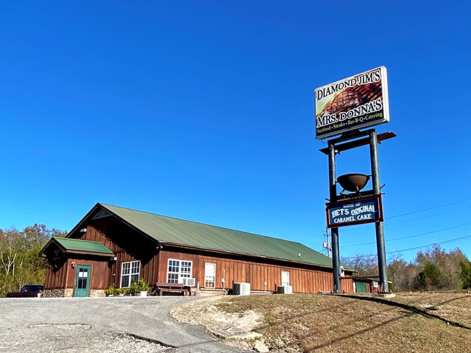 Diamond Jim's rustic wooden exterior stands proudly against the Alabama sky, promising carnivorous delights within those timber walls.