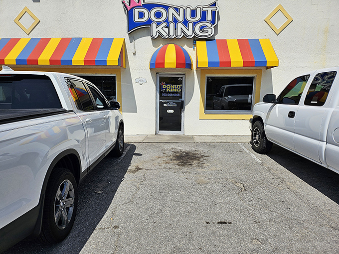 Donut King's carnival-colored awnings promise a circus of flavors inside. Like finding the Wonka factory of donuts hiding in plain sight!
