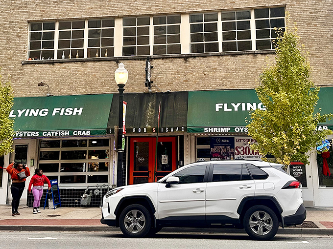 Flying Fish's vintage storefront brings coastal charm to downtown Little Rock. Those "MUDBUGS ARE HERE" banners are like Christmas lights for seafood lovers!