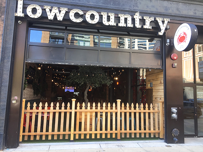 Lowcountry's charming white picket fence isn't keeping anyone out—it's inviting you into seafood paradise! A little slice of Southern hospitality in downtown Chicago.