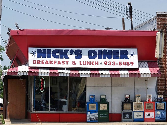 Nick's Diner's bold red sign promises exactly what you need: breakfast, lunch, and a phone number for when the craving strikes again.