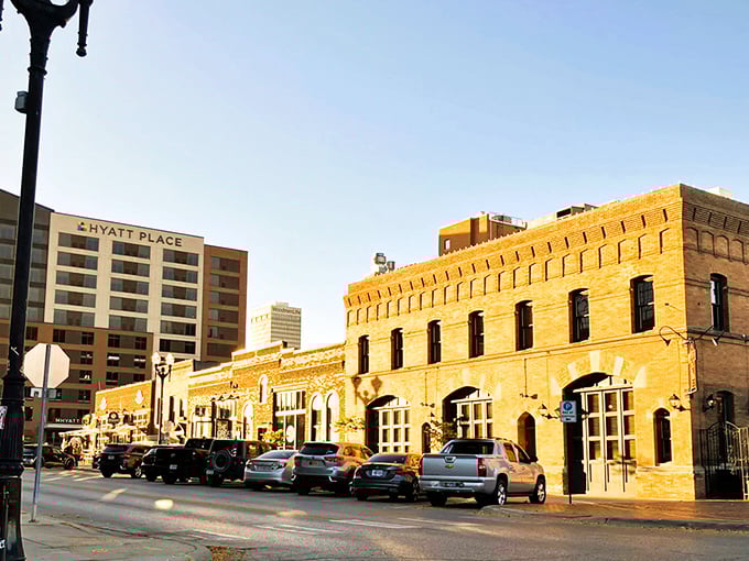 Omaha's Haymarket District glows with warmth at sunset, where historic brick buildings house restaurants and shops that won't break your Social Security budget.
