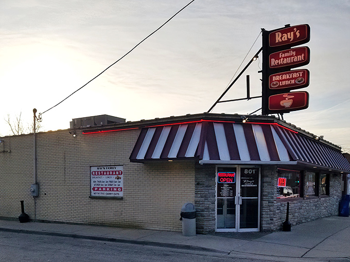Ray's classic red and white awning stands like a beacon for hungry travelers. This family spot screams "comfort food ahead!"