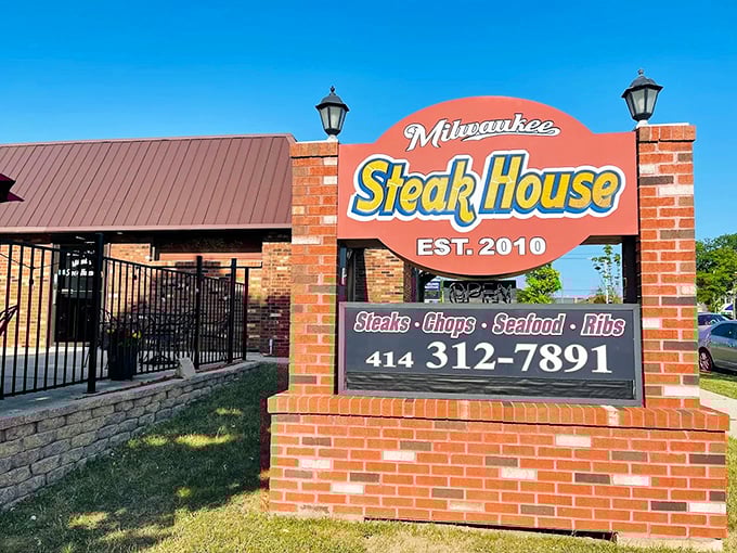 The Milwaukee Steakhouse sign stands proud against the blue sky, like a beacon calling hungry carnivores home. Brick, beef, and beautiful simplicity.