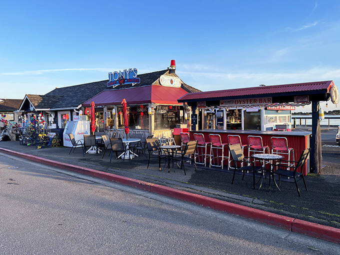 Tony's Crab Shack: Where weathered wood meets waterfront views and those neon signs practically whisper, "The crab here will change your life."