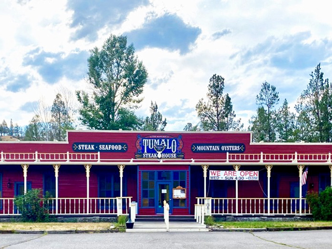 Red, rustic, and ready to rumble! This steakhouse looks like it could tell tales taller than Paul Bunyan, but the real story's on your plate.