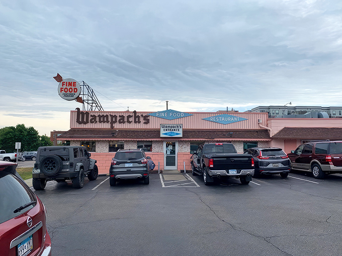 Wampach's Restaurant: That retro pink exterior isn't just a building&mdash;it's a time machine disguised as a restaurant with a "Fine Food" sign that doesn't lie.