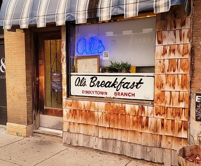 Al's Breakfast blue awning: "The blue-striped awning marks the spot where breakfast dreams come true. Just 14 seats of pure pancake paradise!"