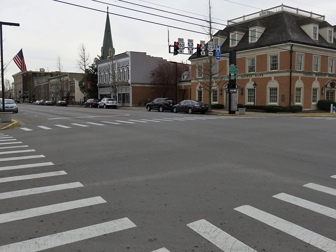 Historic brick buildings and a quiet intersection greet you as you explore the classic charm of downtown Danville on foot.