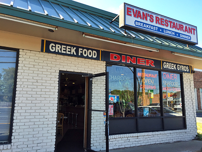 The bold "Greek Food" sign isn't just decoration&mdash;it's a promise that Evan's delivers on with every bite of their authentic Mediterranean dishes.