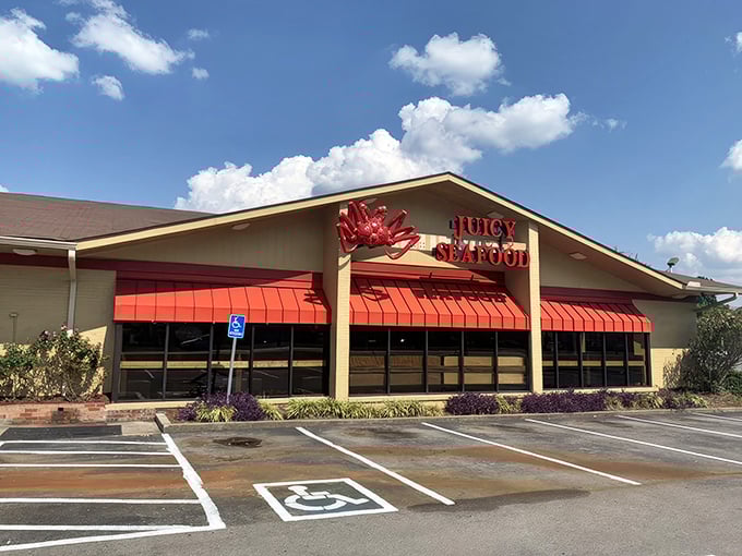 Under that bright orange awning lies seafood nirvana—where bibs aren't optional and finger-licking is mandatory.