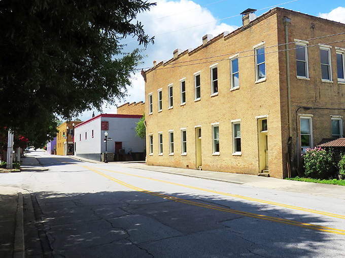 Sunlight bathes Newberry's quiet streets where brick buildings tell stories of generations who've walked these same paths.