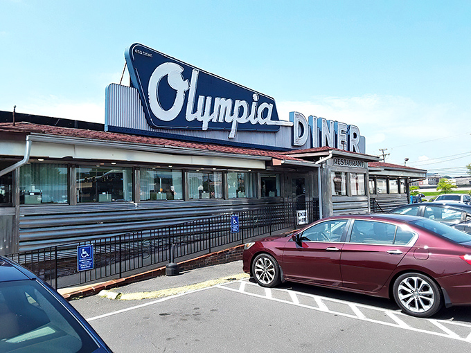 Sunset casts a magical glow on Olympia Diner's classic profile &ndash; where chrome dreams and comfort food meet. 